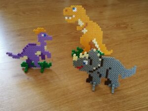 10 Dinosaur Perler Beads Patterns In Fun Colors - Julie Ann Art